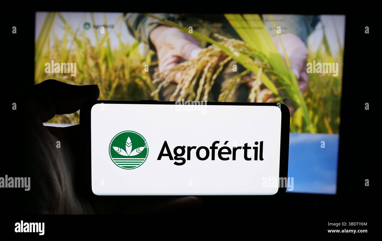 In this photo illustration, a person is holding a cellphone with the logo of Paraguayan ...