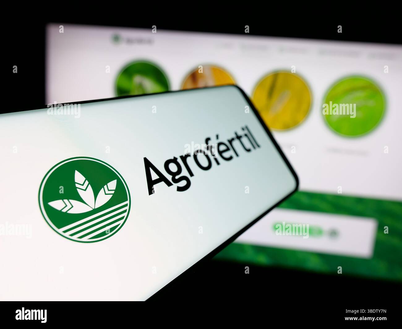 In this photo illustration, a smartphone with the logo of Paraguayan fertilizer company ...