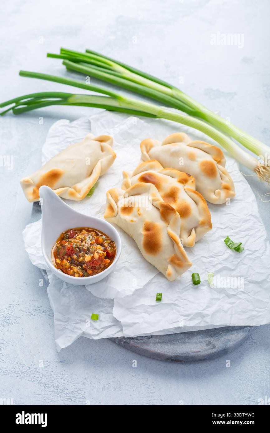Traditional empanadas with chimichurri sauce. Latin American cuisine ...