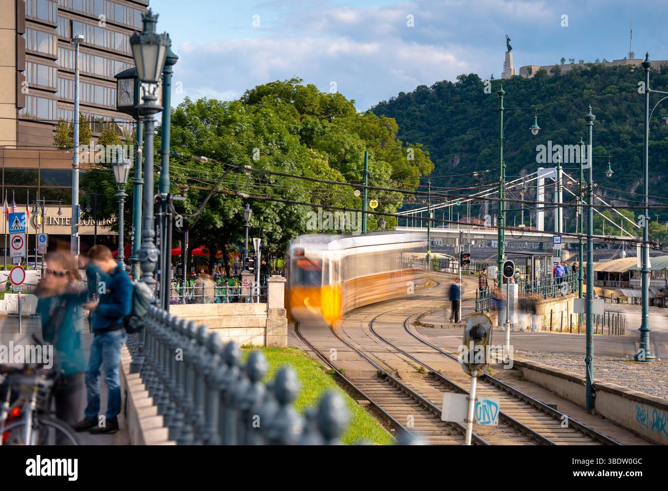 Budapest, Hungary - May 24, 2025: Yellow tram approaching the Eötvös ...