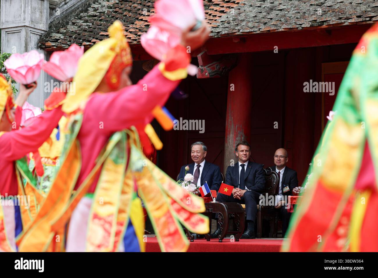 French President Emmanuel Macron, center, watches a traditional dance ...