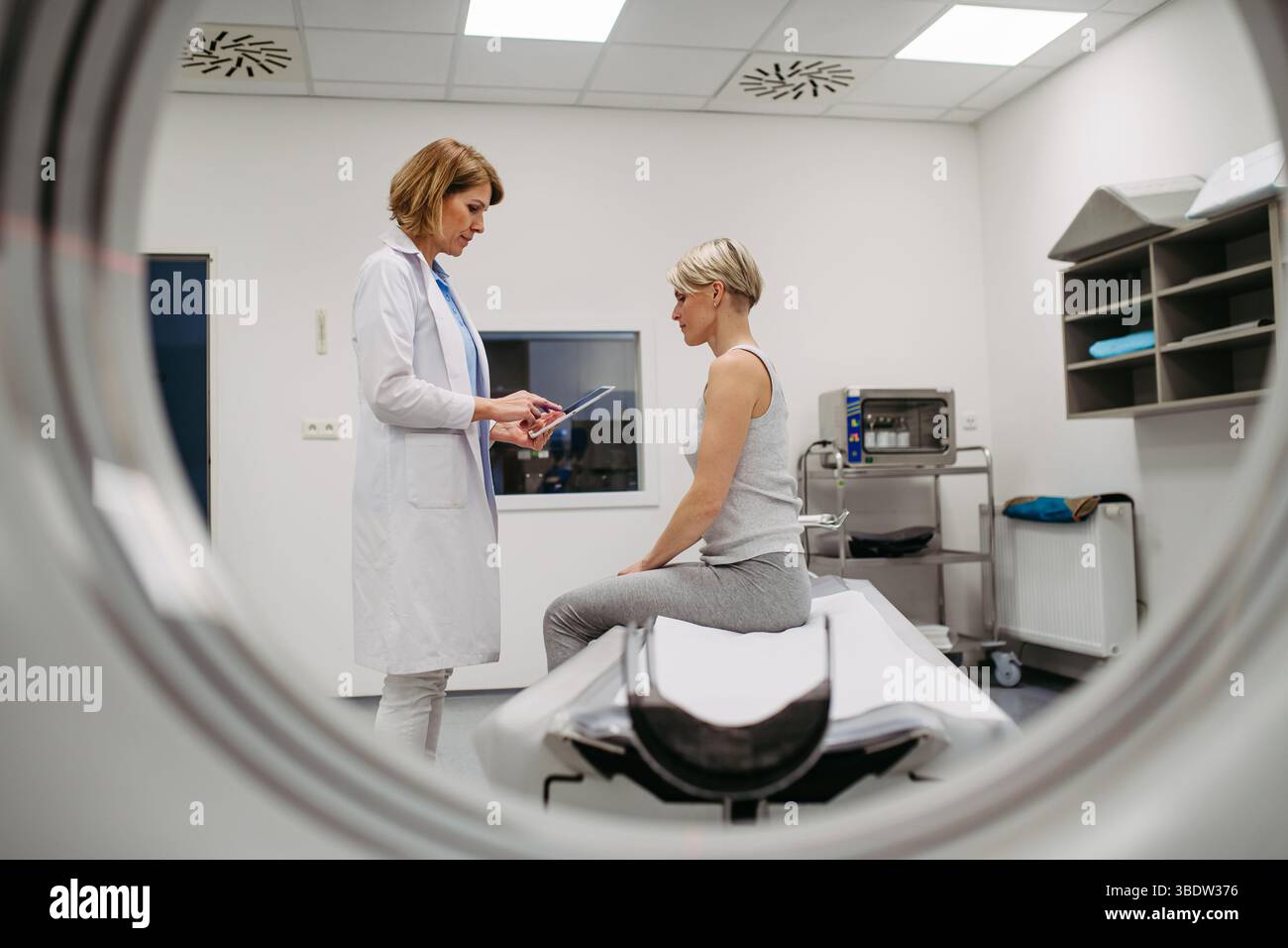 Medical professional delivering difficult news after diagnostic scan ...