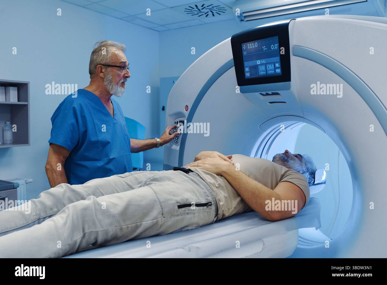 Male patient undergoing CT scan examination in hospital Stock Photo - Alamy