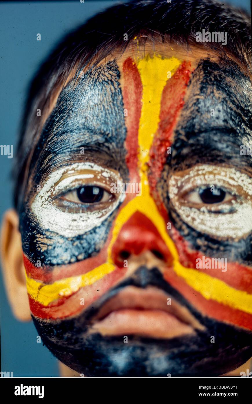 Children wearing Face colours as Masks Stock Photo - Alamy