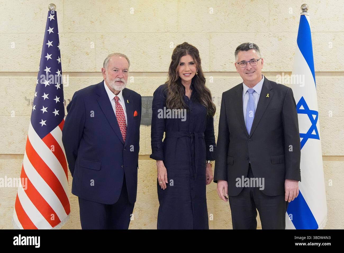 U.S. Homeland Security Secretary Kristi Noem, center, and US Ambassador ...
