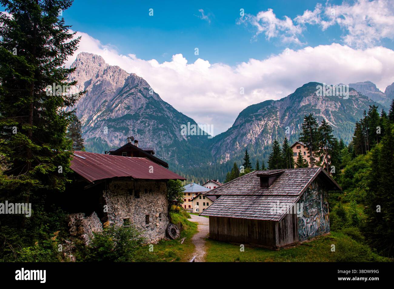 Traditional wooden houses nestled in the mountains, surrounded by ...