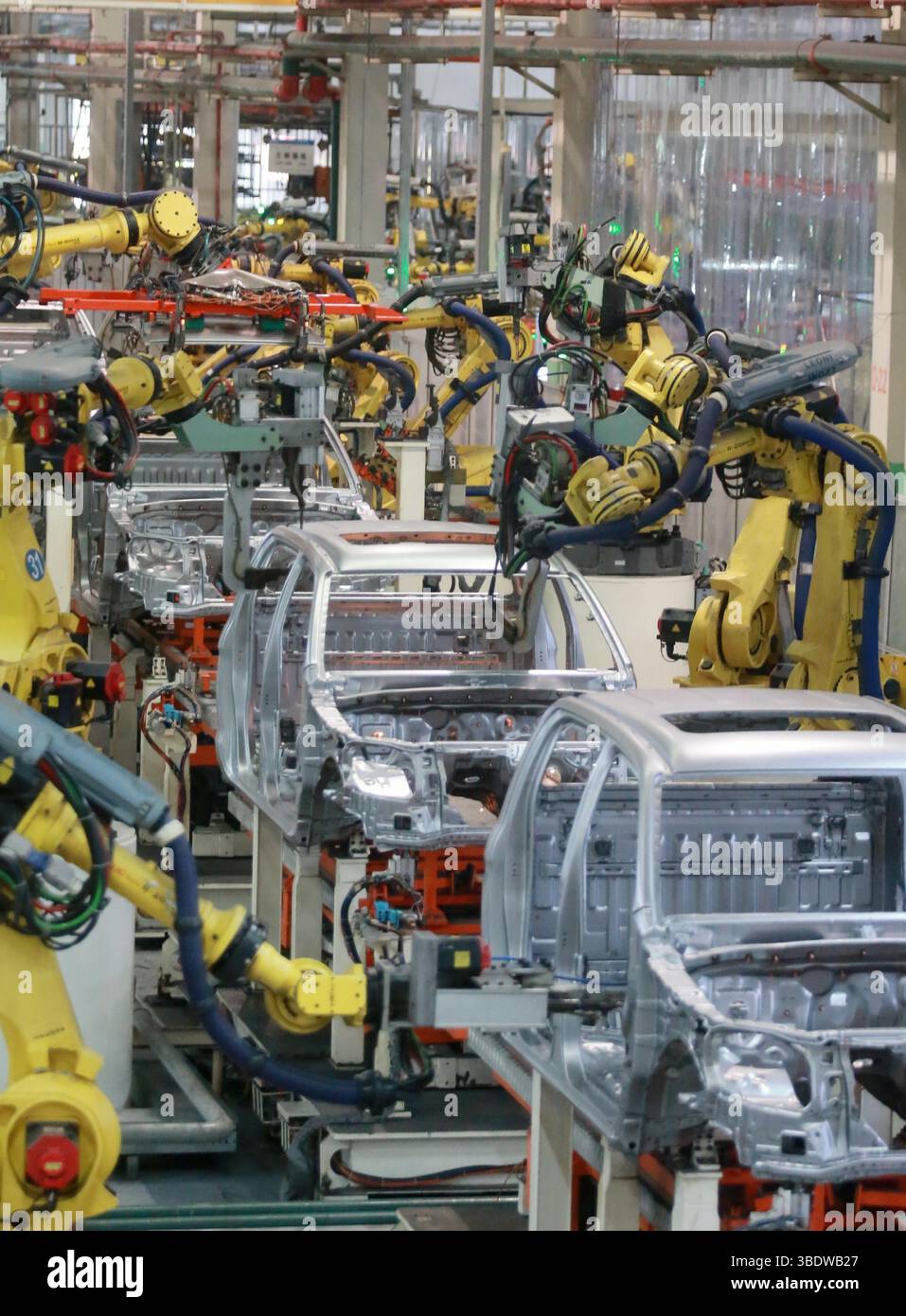 Busy smart assembly line of an auto manufacturing enterprise in ...