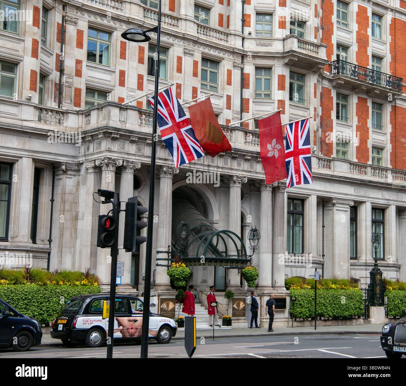Grand historical building The Mandarin Oriental with Union Jack flags ...