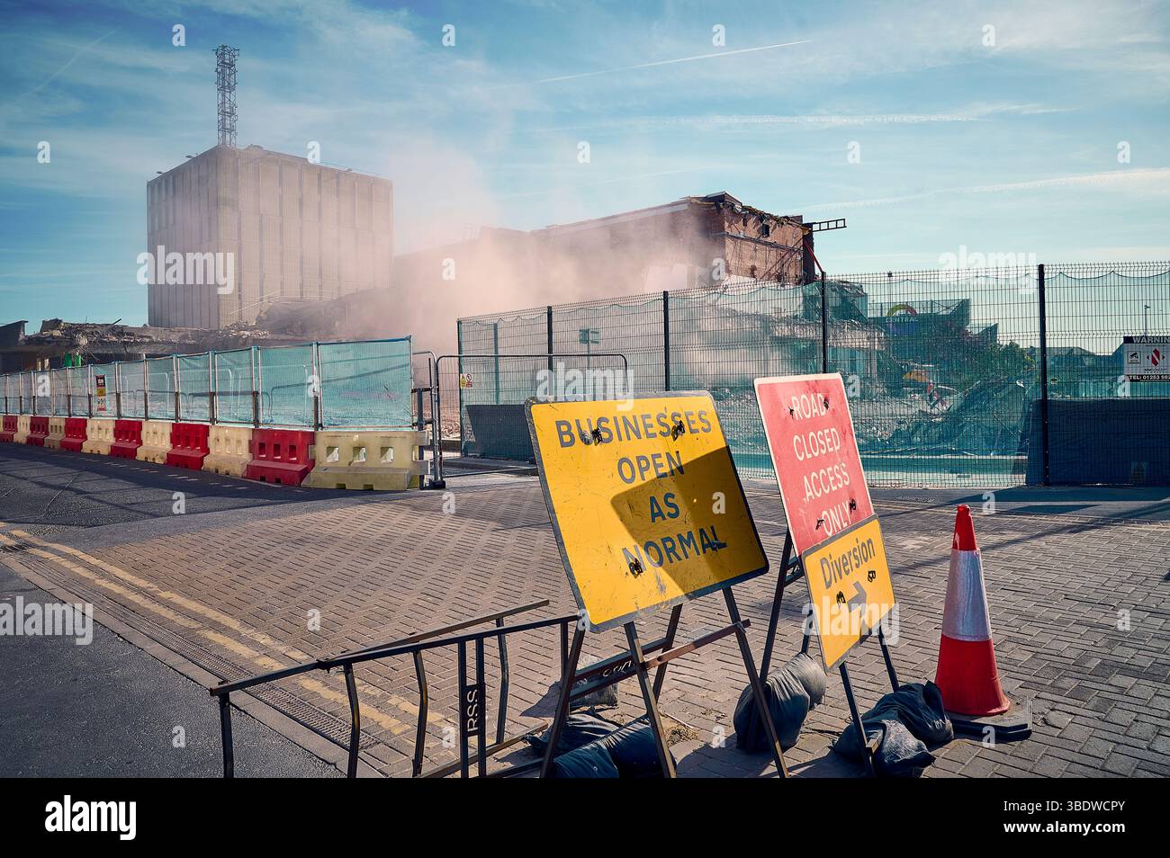 Dust settling on a demolition site in the early morning sun Stock Photo ...