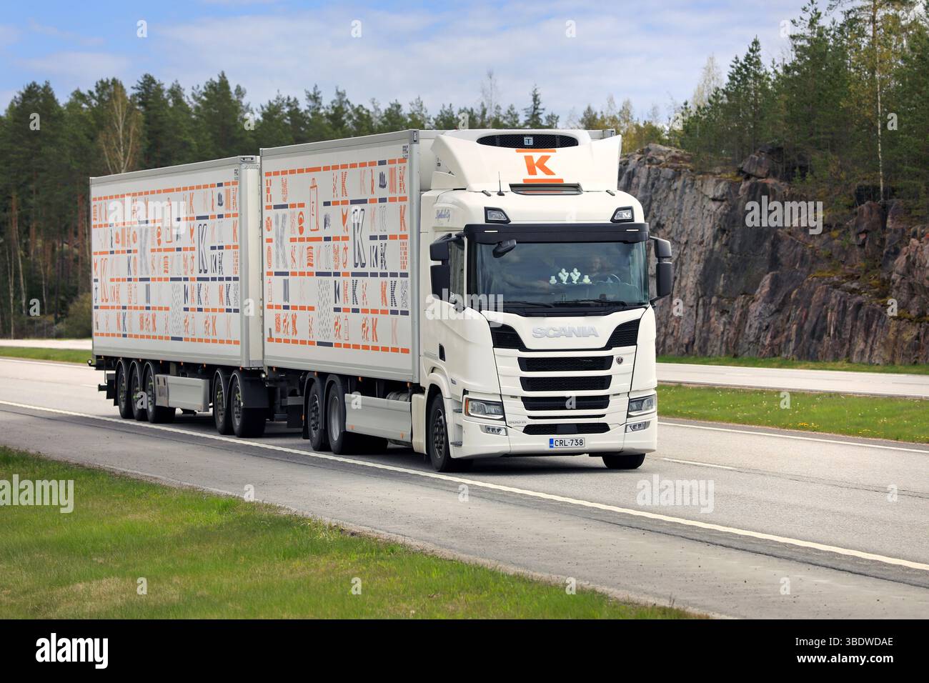 White Scania 500R truck pulls refrigerated trailer for Kesko ...