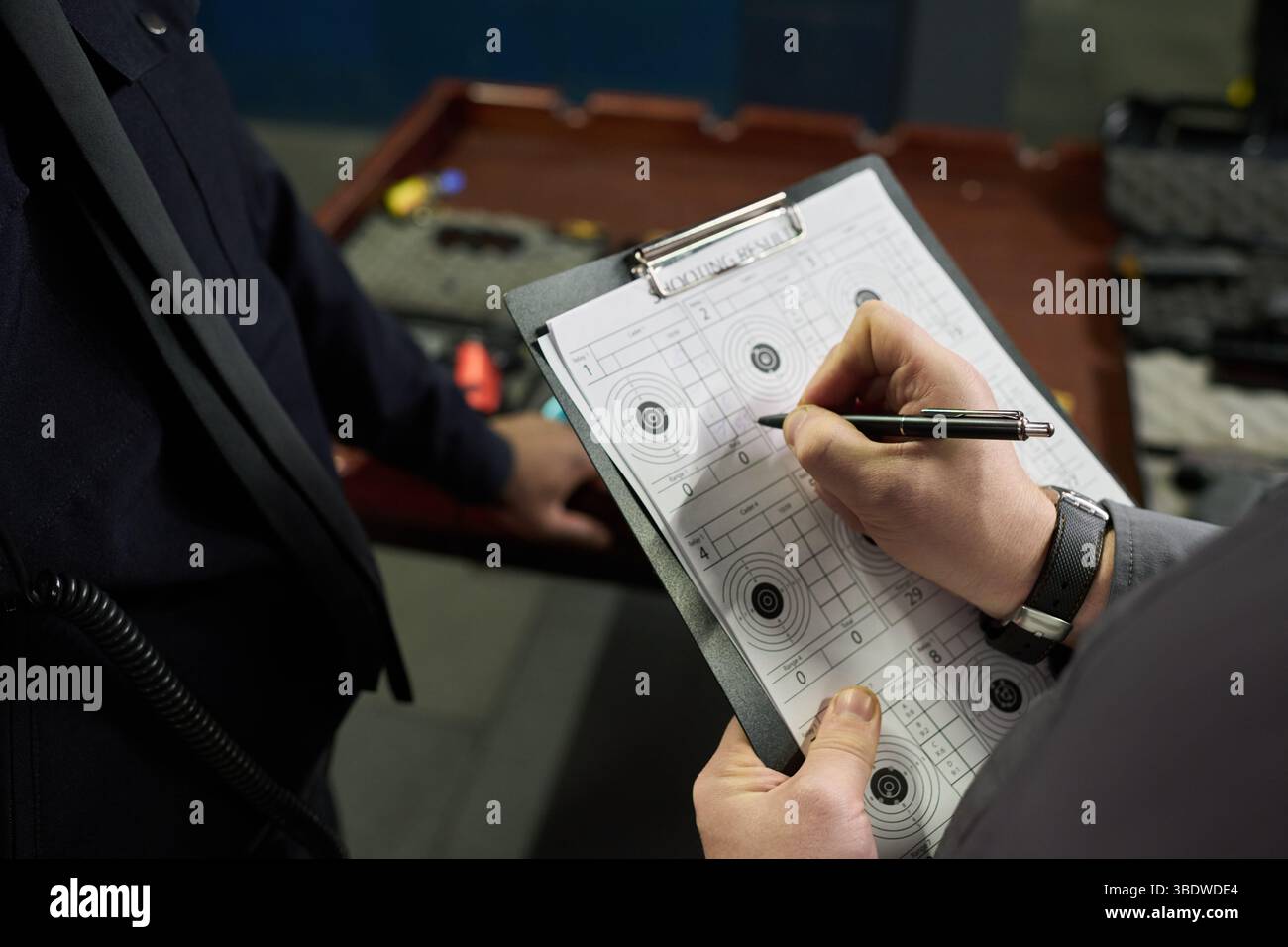 Examining score sheets hi-res stock photography and images - Alamy