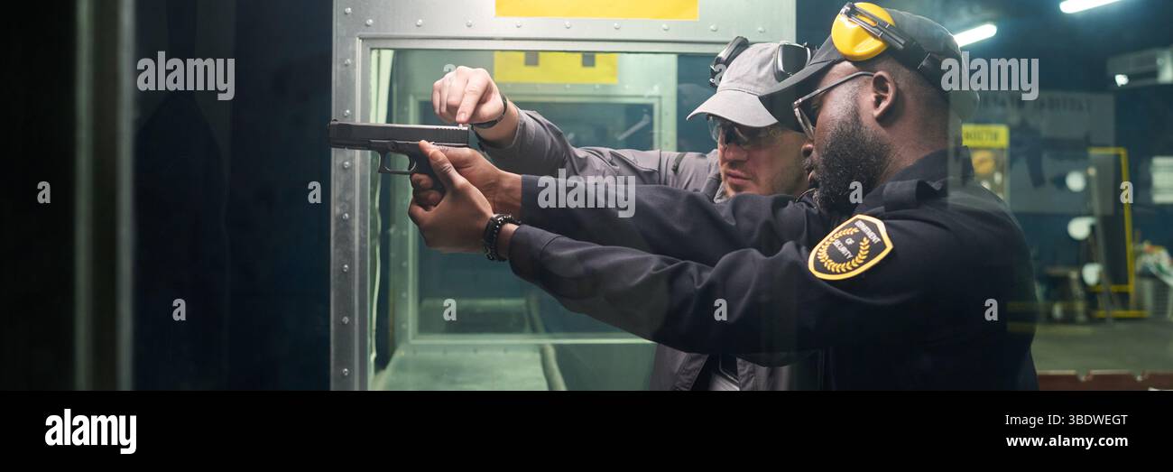 Instructor and trainee engaging in shooting range activity. Focus on ...
