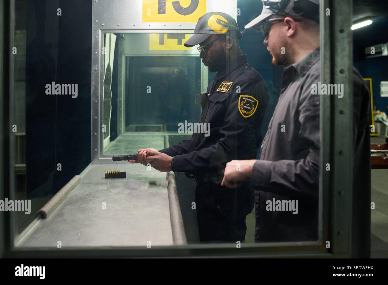 Security officers examining firearms hi-res stock photography and ...