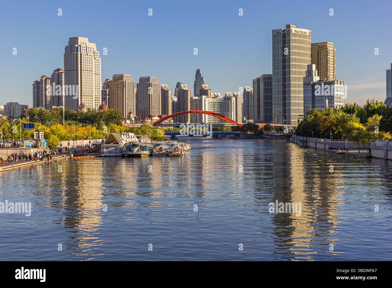 Hai River with cruise boat harbor and apartment buildings in Tianjin ...