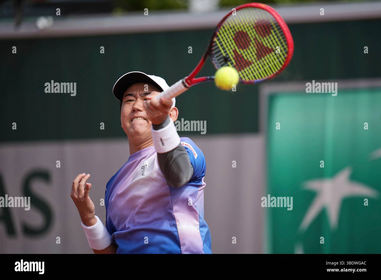 Japan's Yoshihito Nishioka hits a forehand against Australia's Alexei Popyrin, during their ...