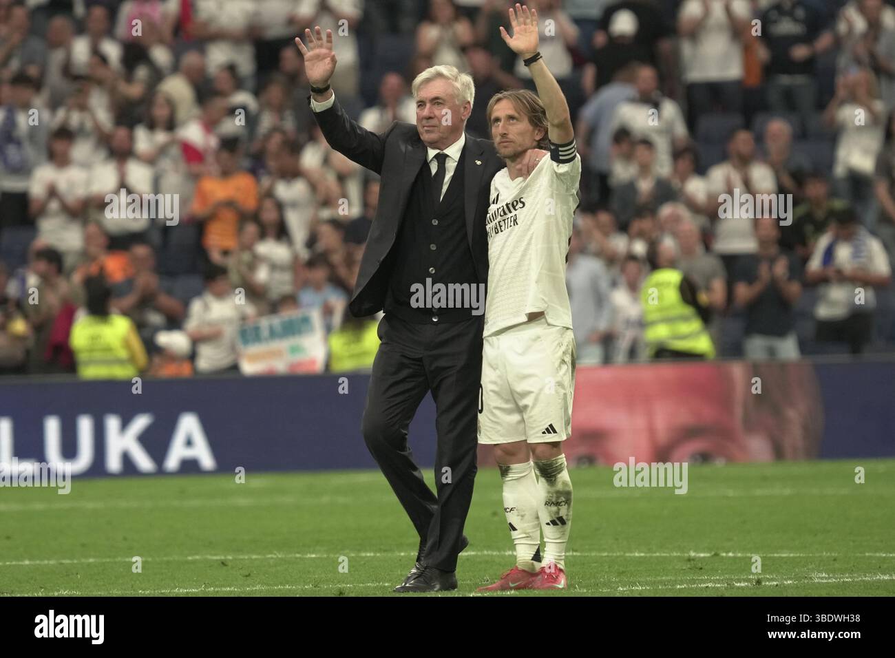 Real Madrid's Luka Modric and head coach Carlo Ancelotti applaud fans after the Spanish La Liga ...