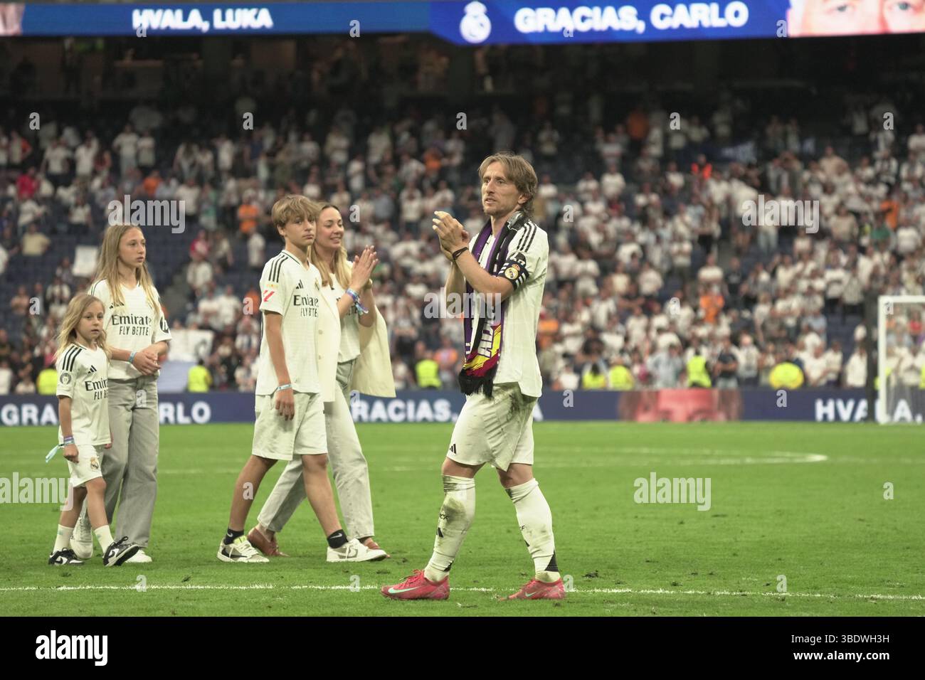 Real Madrid's Luka Modric applauds fans with his family after the ...