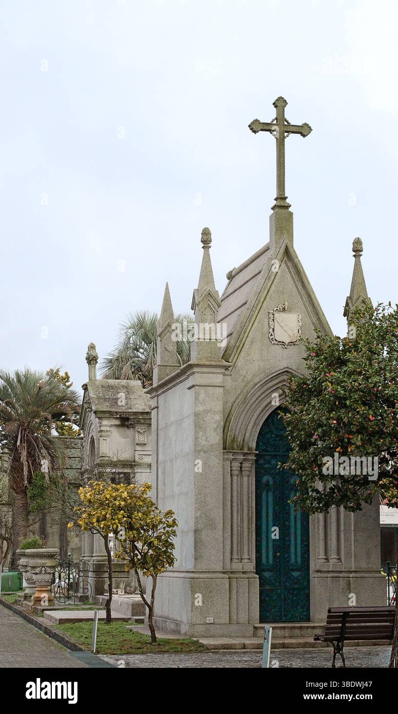 Stone mausoleum with ornate cross, cemetery Stock Photo - Alamy