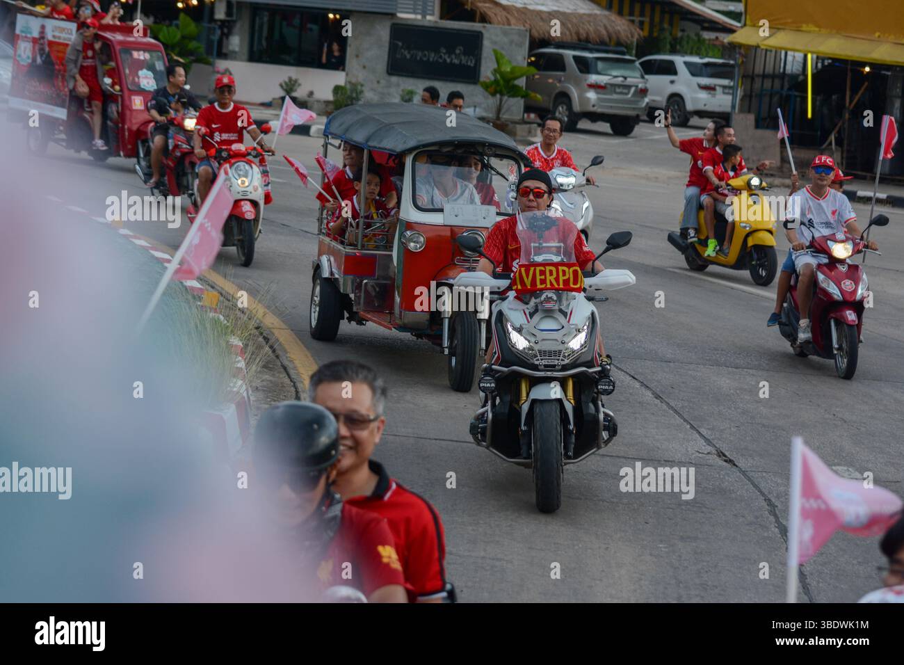 Liverpool FC fans ride motorcycles and scooters through the streets of ...