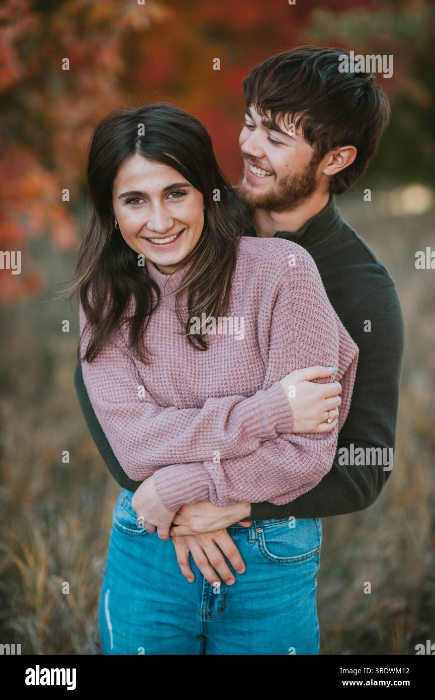 Romantic young pair shares a tender moment in fall landscape Stock ...