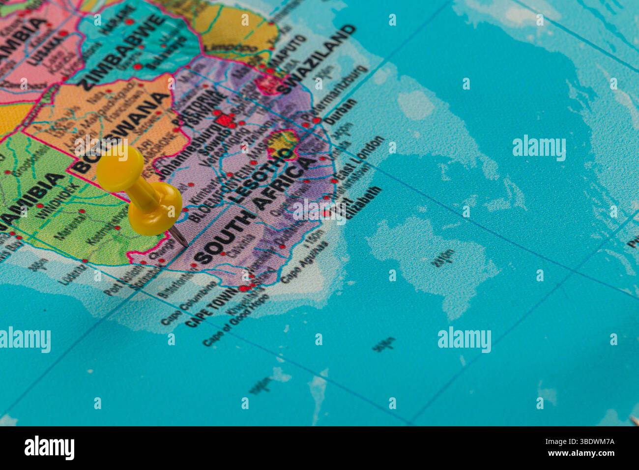 A yellow pushpin signifies a specific location on a vibrant map of ...