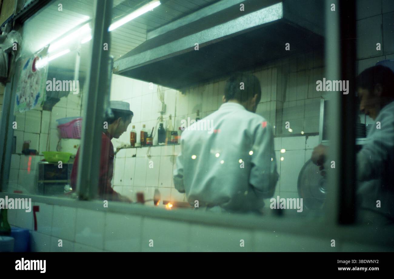 Late 2000s Chinese Restaurant Kitchen with Chefs Cooking Stock Photo ...
