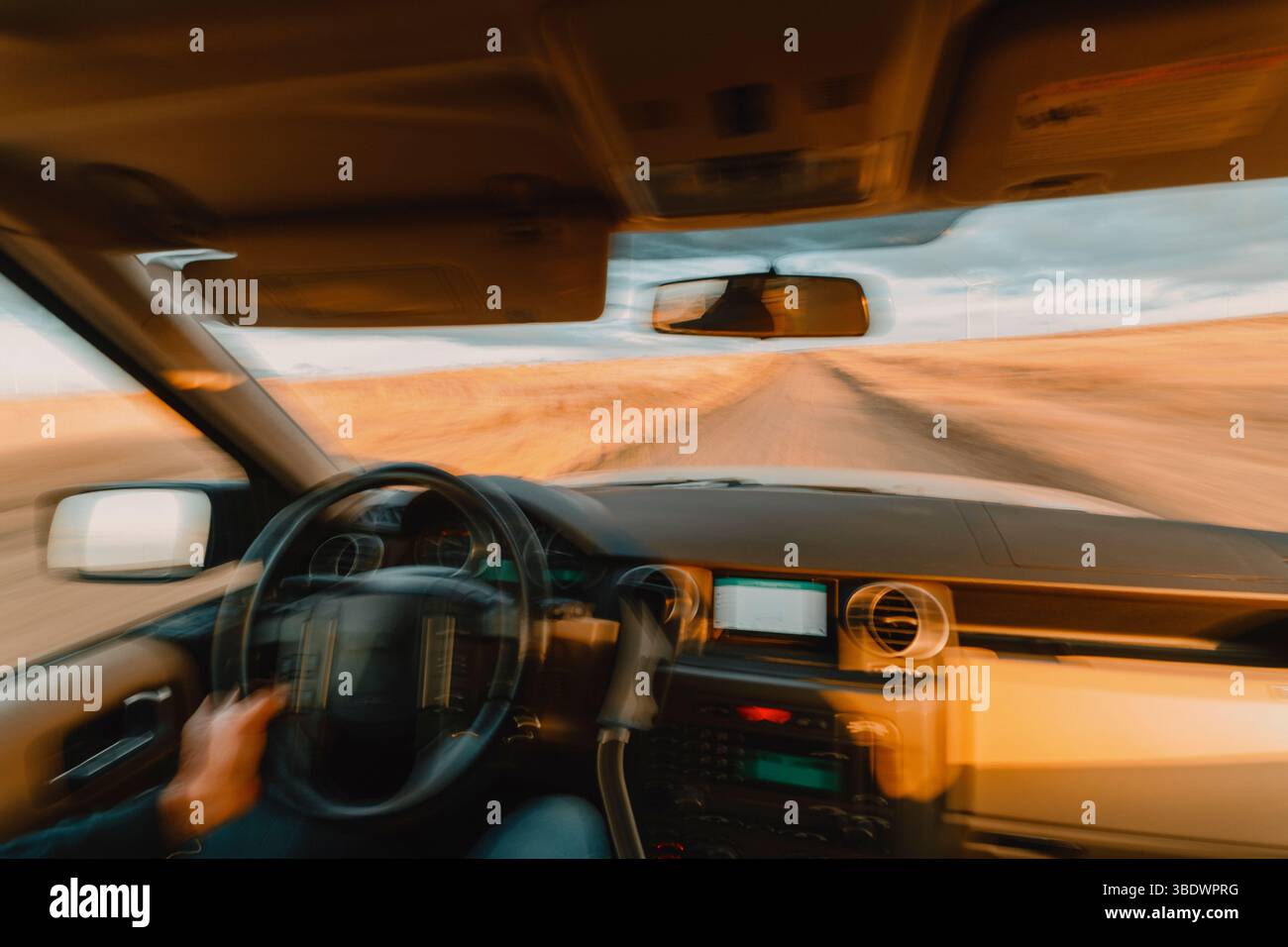 Driving into the distance with sunset blur from inside Stock Photo - Alamy