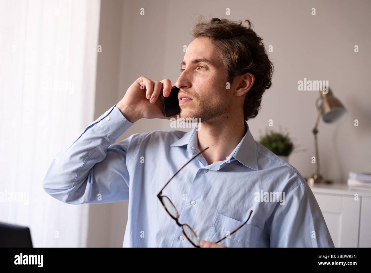 Stressed professional in the office during constant meetings Stock ...
