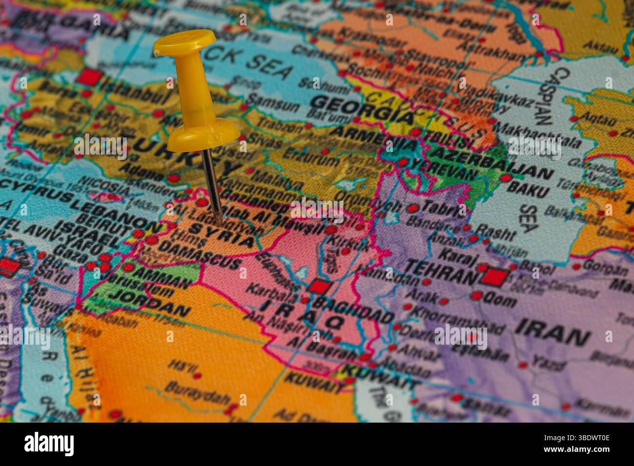 A bright yellow pushpin highlights a specific area in Syria on a ...