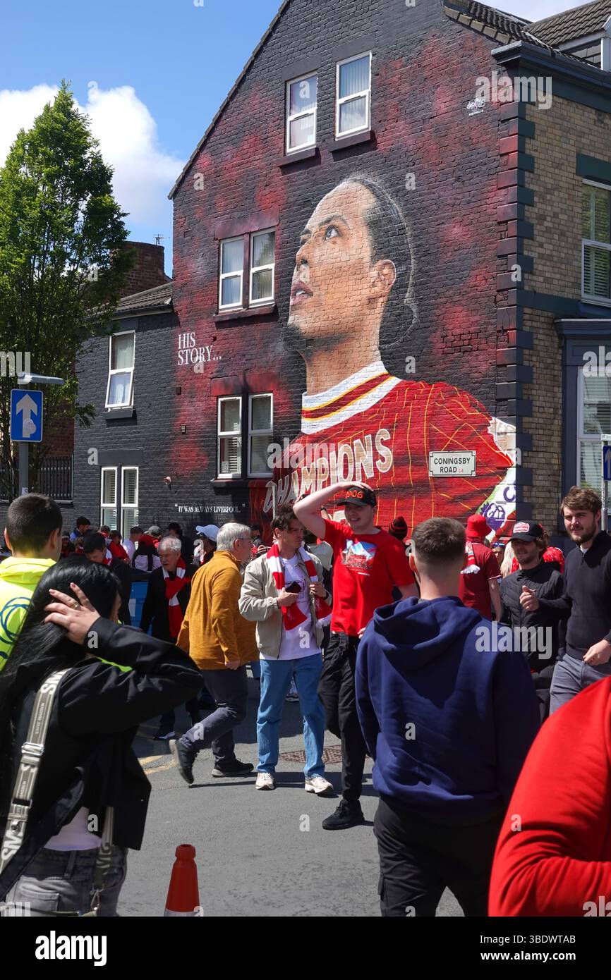 Fans take photo's of the new mural of Liverpool captain Virgil van Dijk ...