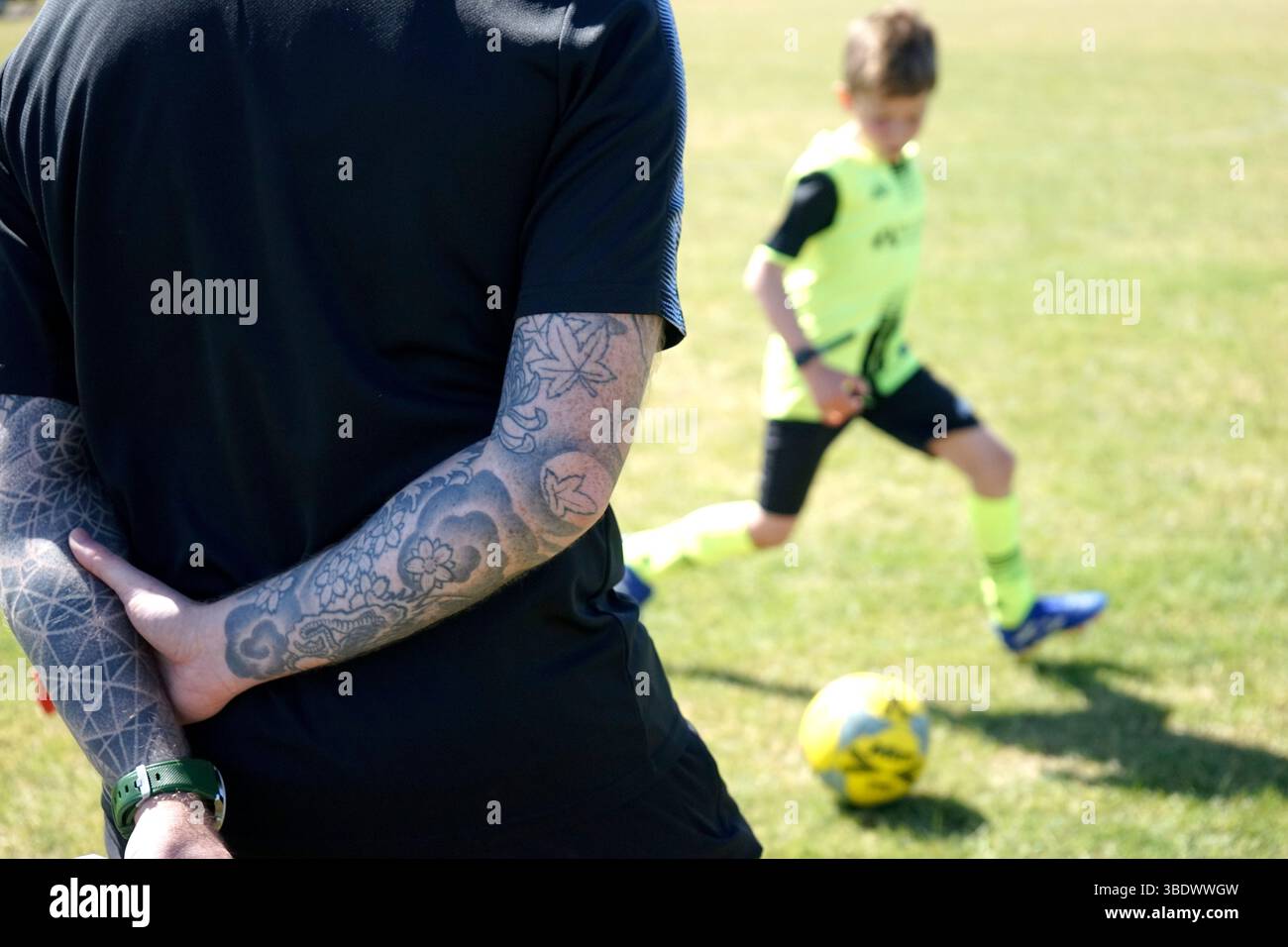 Tattooed Assistant referee Stock Photo - Alamy