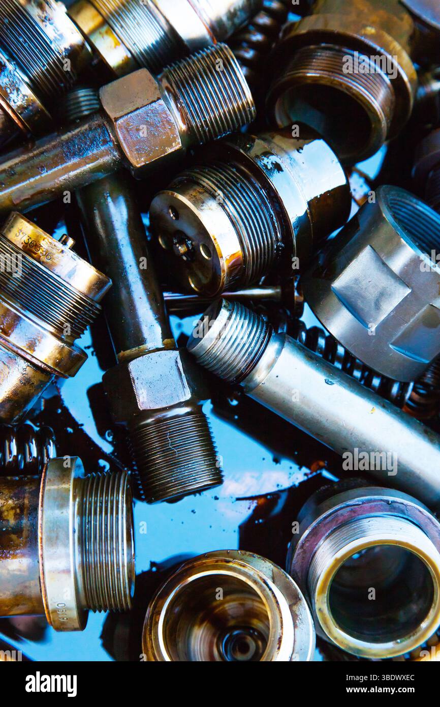 Details of the ship's main engine in oil close-up. Nozzles, bushings ...