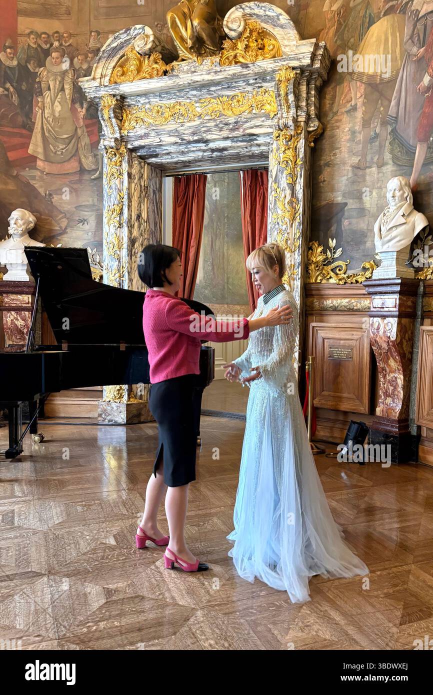 South Korean soprano singer Sumi Jo, right, is worded by former French ...