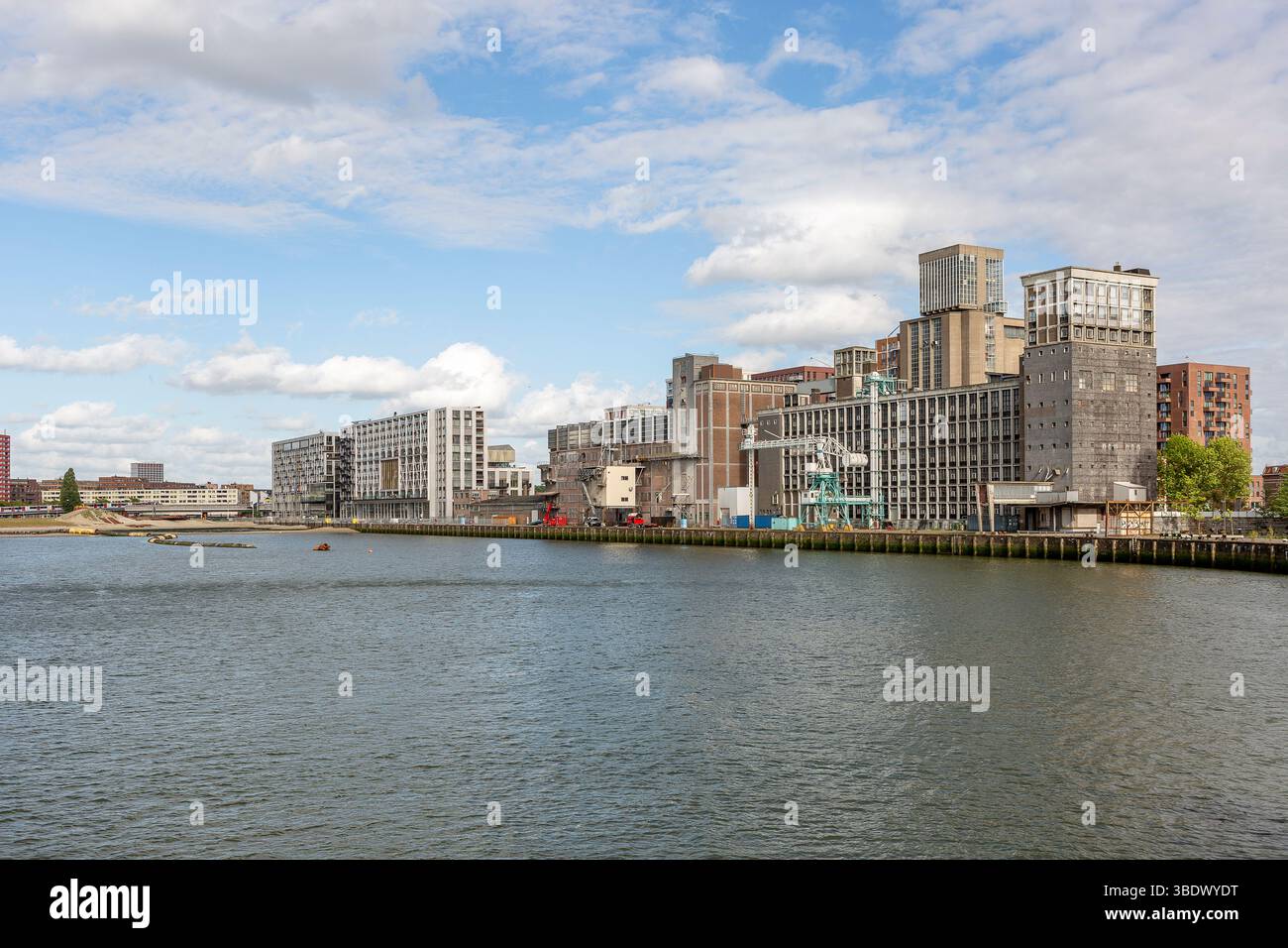 Floating office with behind old industrial processing factory and silo ...