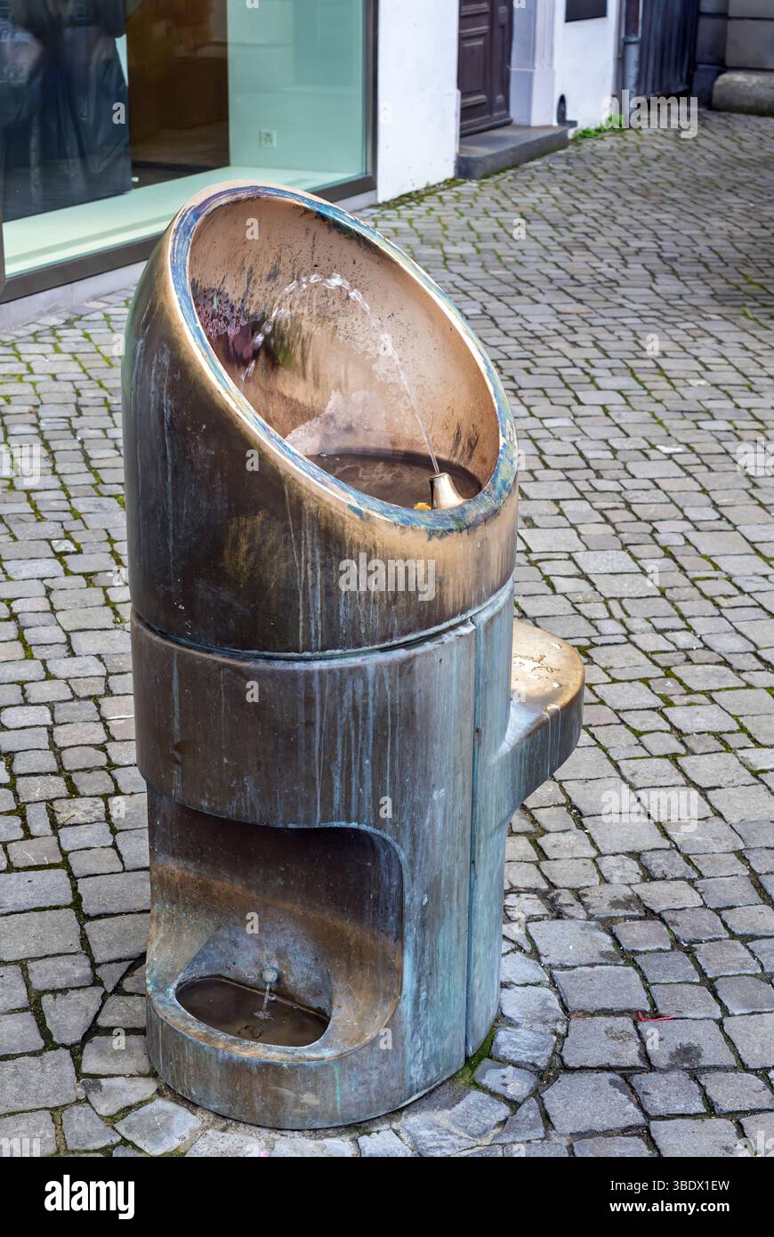 Modern Bronze Public Drinking Fountain with Patina on Cobblestone ...