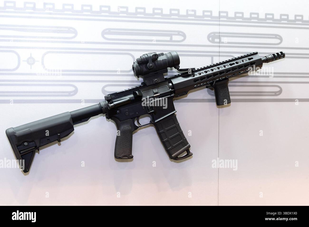 Modern automatic rifle on the wall of a gun shop. Weapon Stock Photo ...