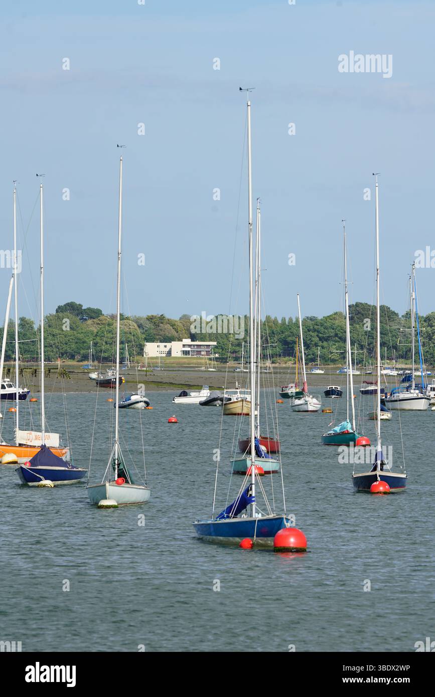 Sailboats Anchored in Calm Harbor Under a Clear Blue Sky. Itchenor, UK ...