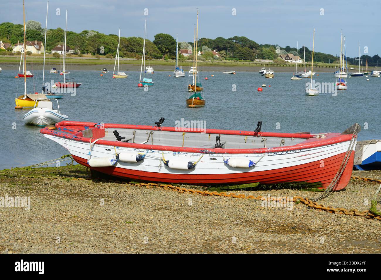 Colorful Wooden Boat on a Scenic Coastal Shoreline with Boats. Itchenor ...