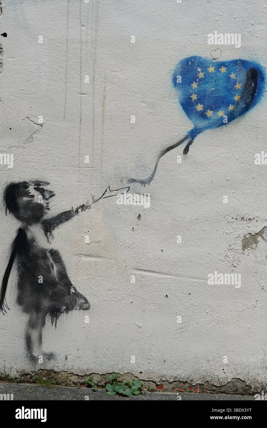 Street Art Depicting Girl and Balloon Representing Unity and Separation ...