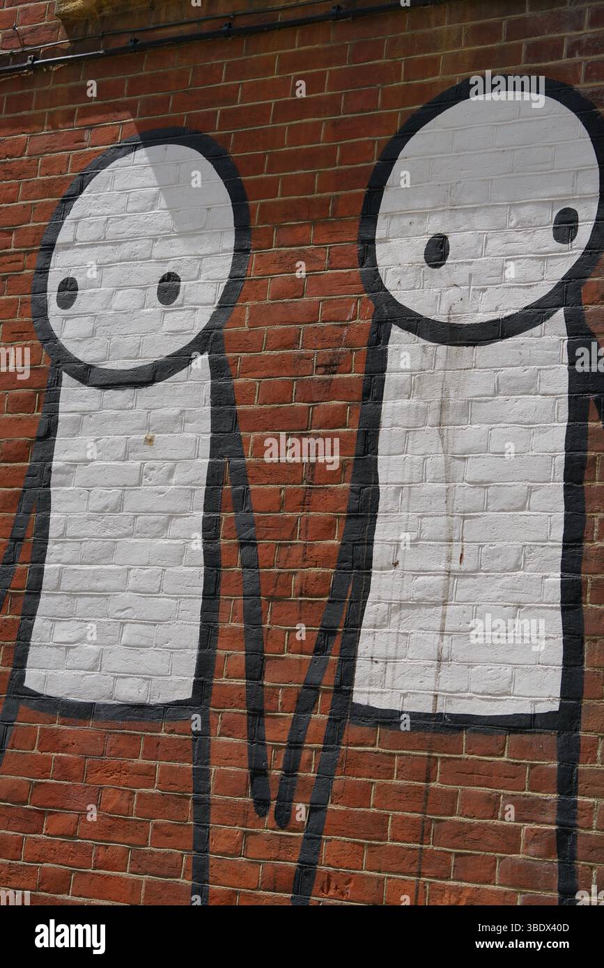 Abstract Mural Depicting Simplistic Figures on a Brick Wall in Urban by ...