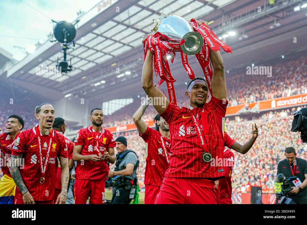 Liverpool's Trent Alexander-Arnold celebrates with the Premier League ...
