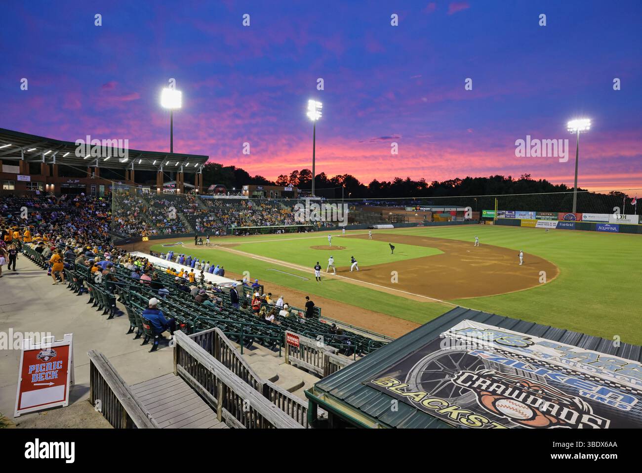 Hickory, NC: A view of the stadium at sunset in the seventh inning ...