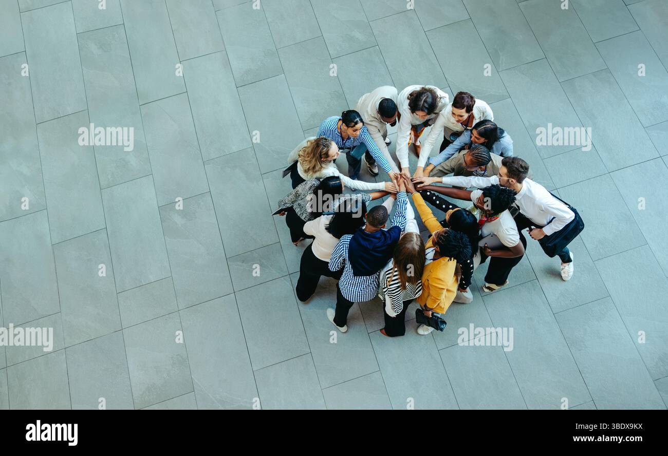 A diverse team demonstrating innovation and unity in a corporate ...