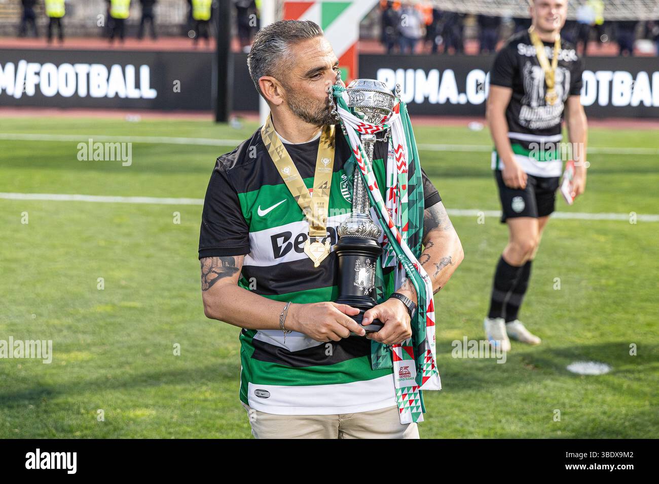 Head Coach Rui Borges of Sporting CP celebrates with the trophy during ...