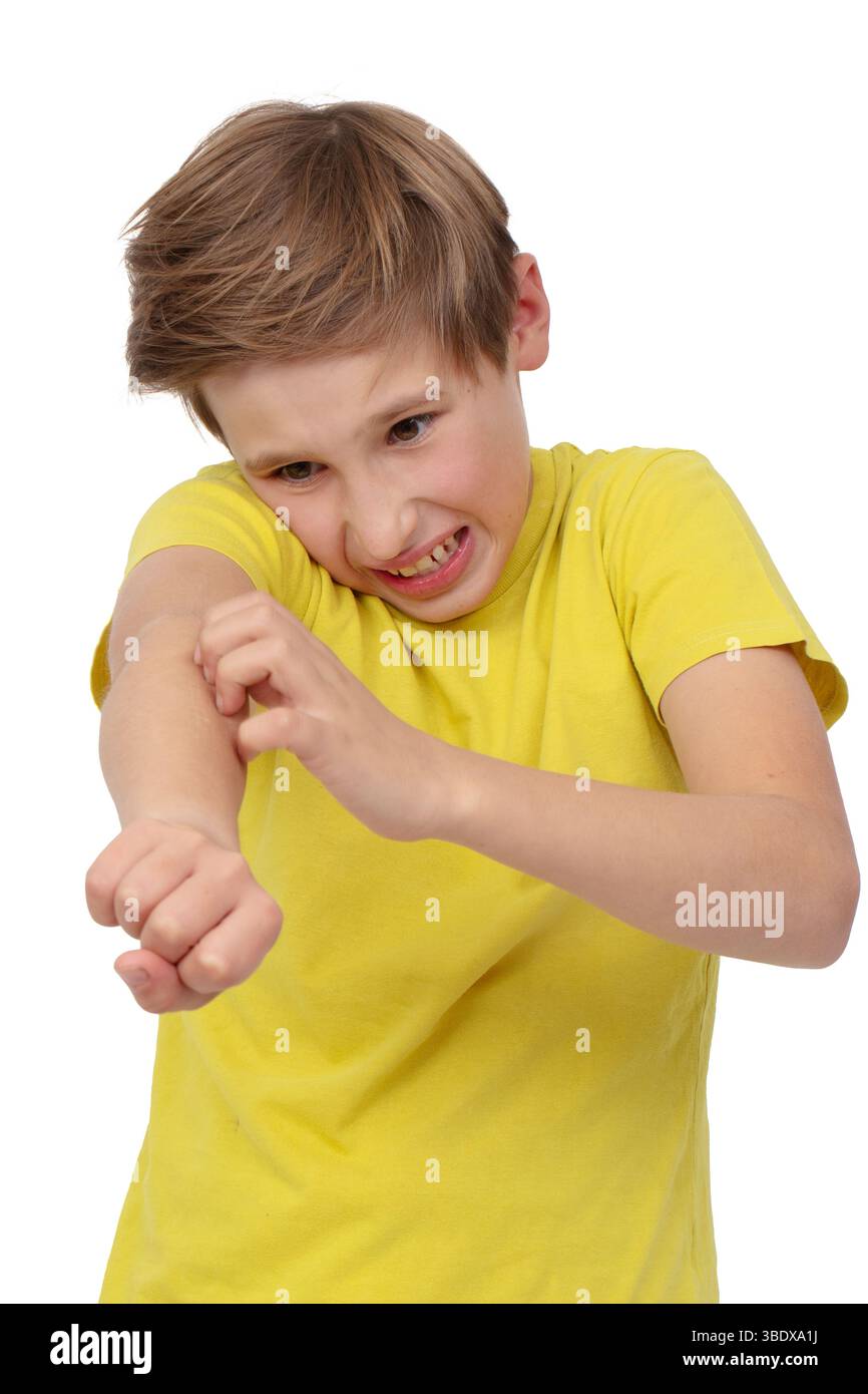 The boy in the yellow T-shirt is scratching his arm badly. The child ...