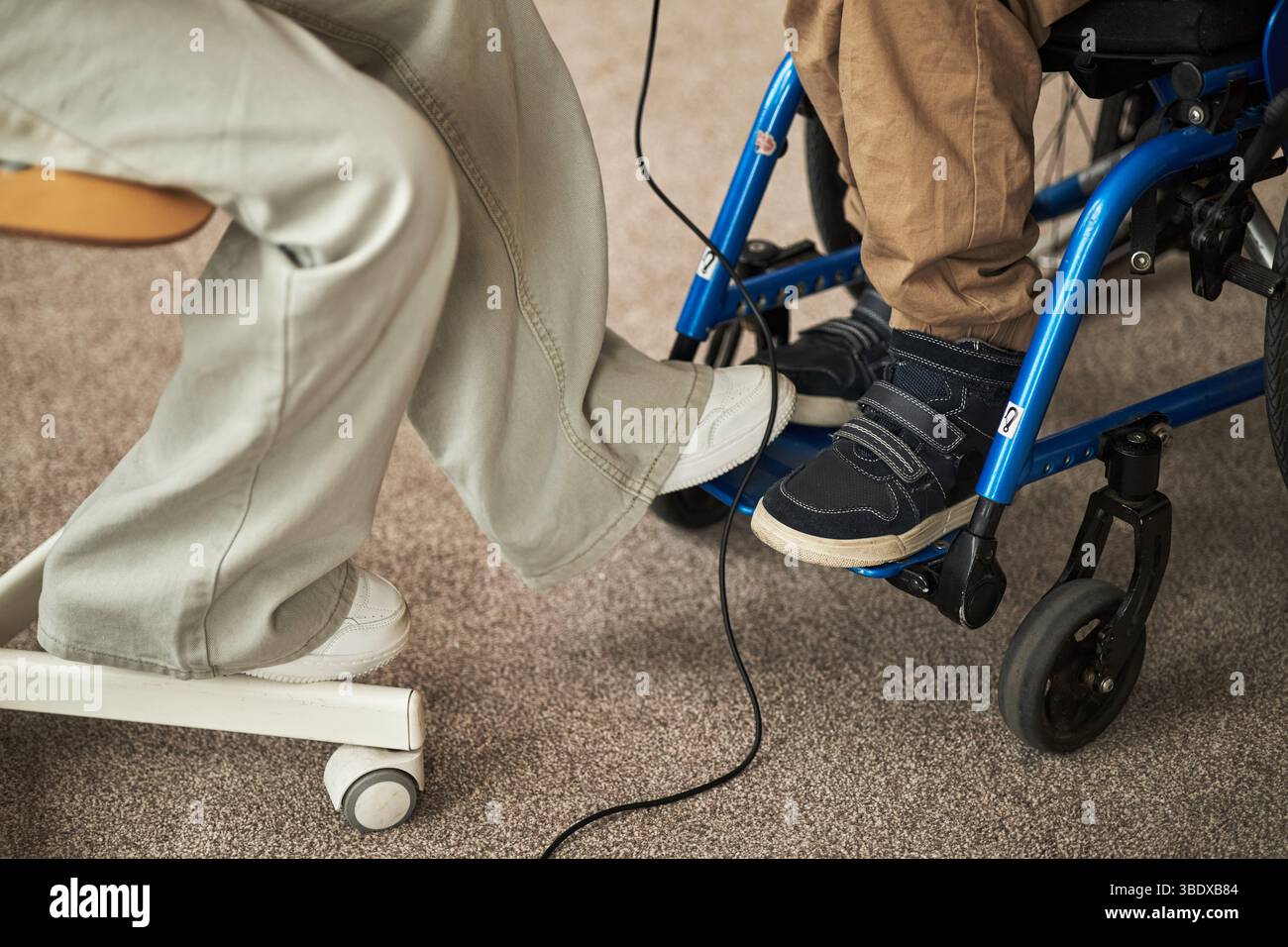 Caring for Person Using Wheelchair in Home Setting Stock Photo - Alamy