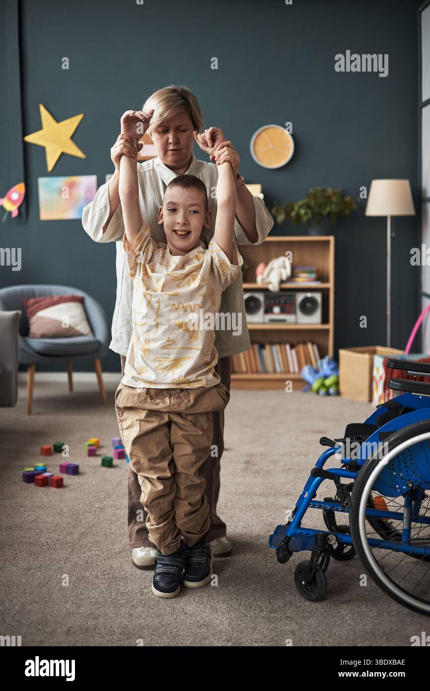 Assisting Child Learning Mobility with Adult Support Stock Photo - Alamy