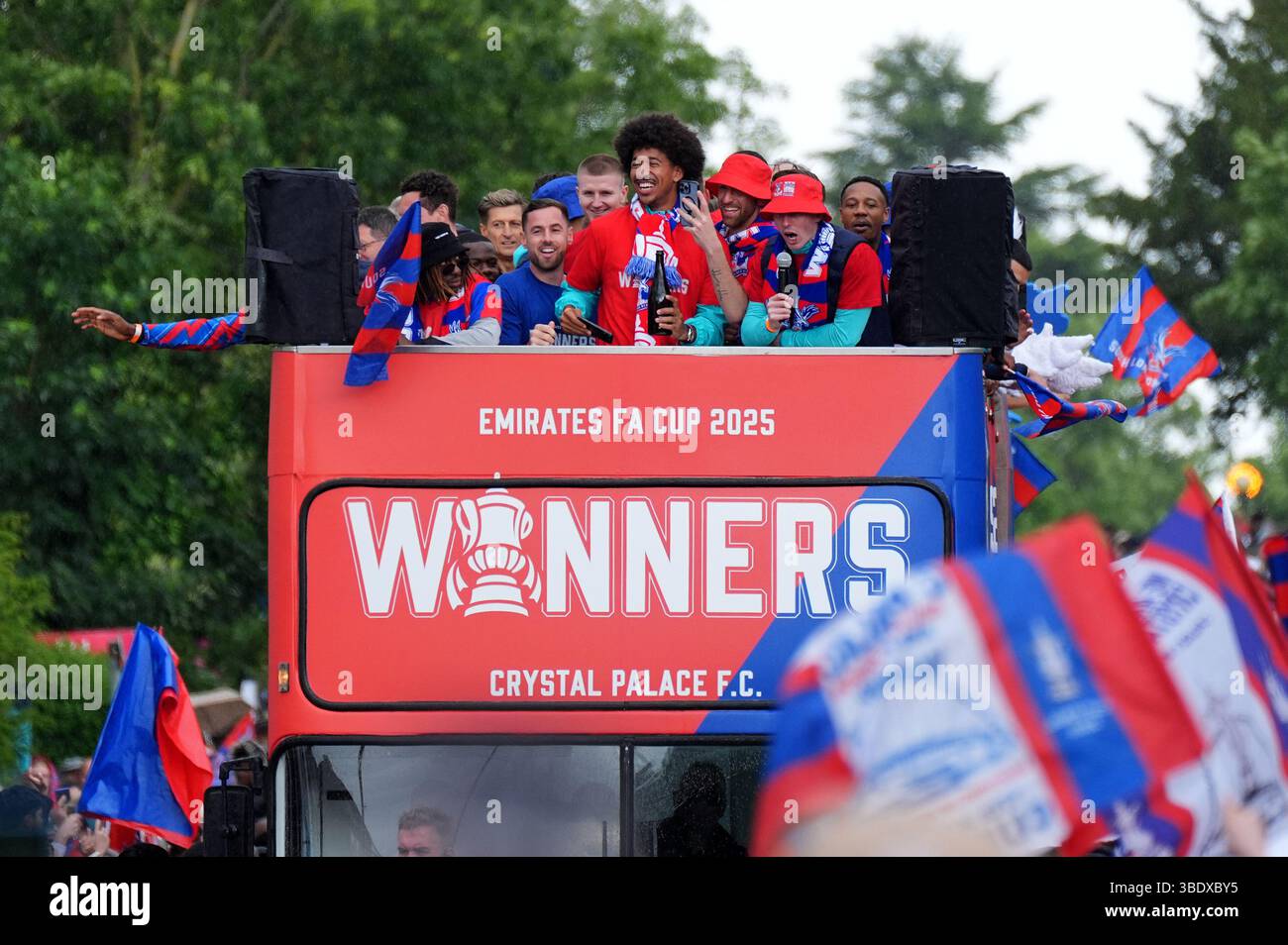 Crystal Palace players on a open-top bus pass by fans during the FA Cup ...