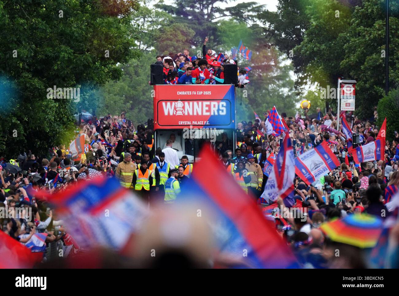 Crystal Palace players on a open-top bus pass by fans during the FA Cup ...
