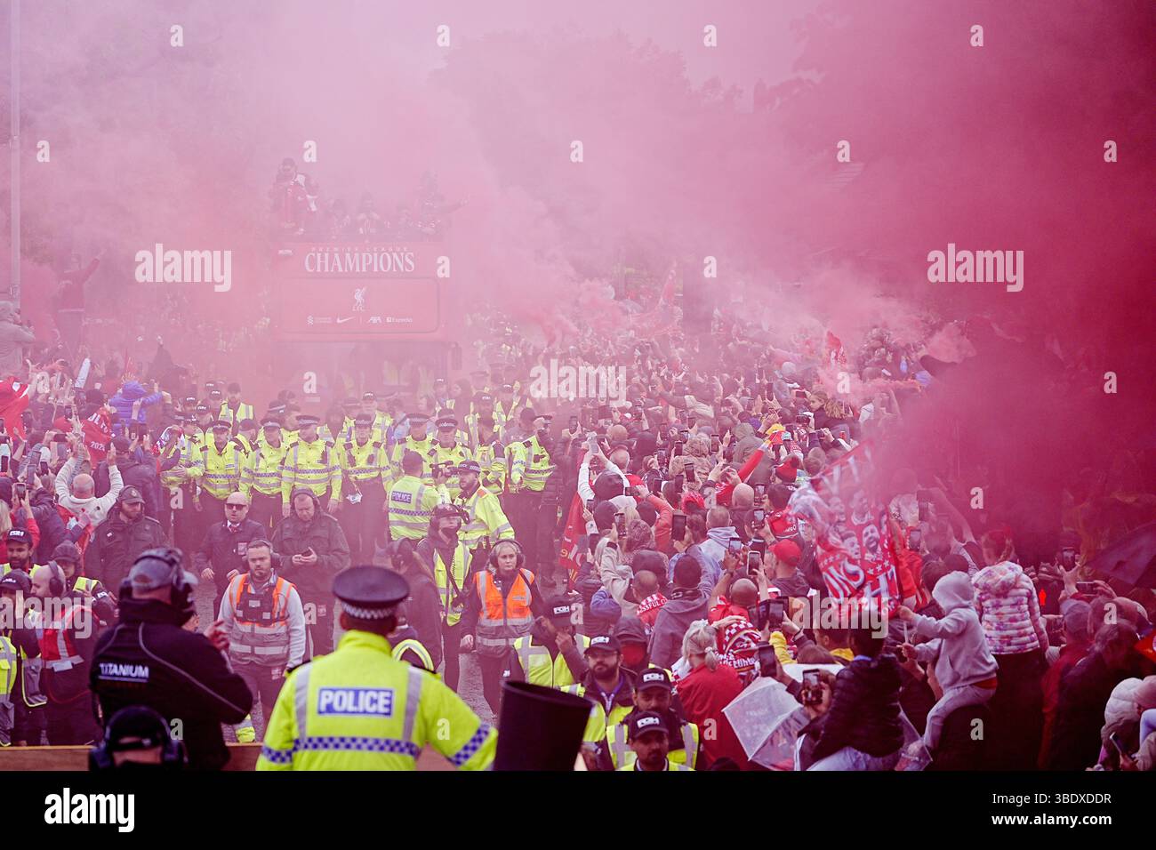 Liverpool fans watch on as the team bus approaches during the Premier ...